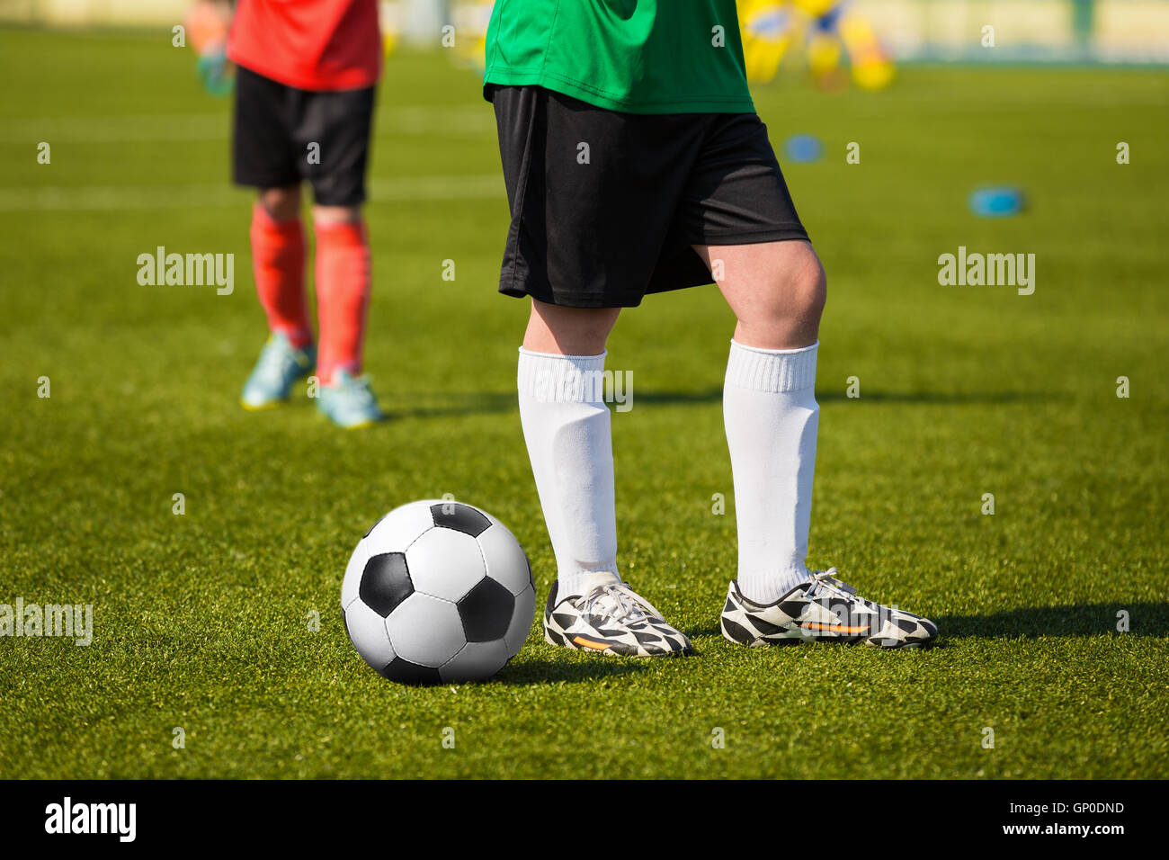 Young soccer football player standing on the soccer field Stock Photo ...