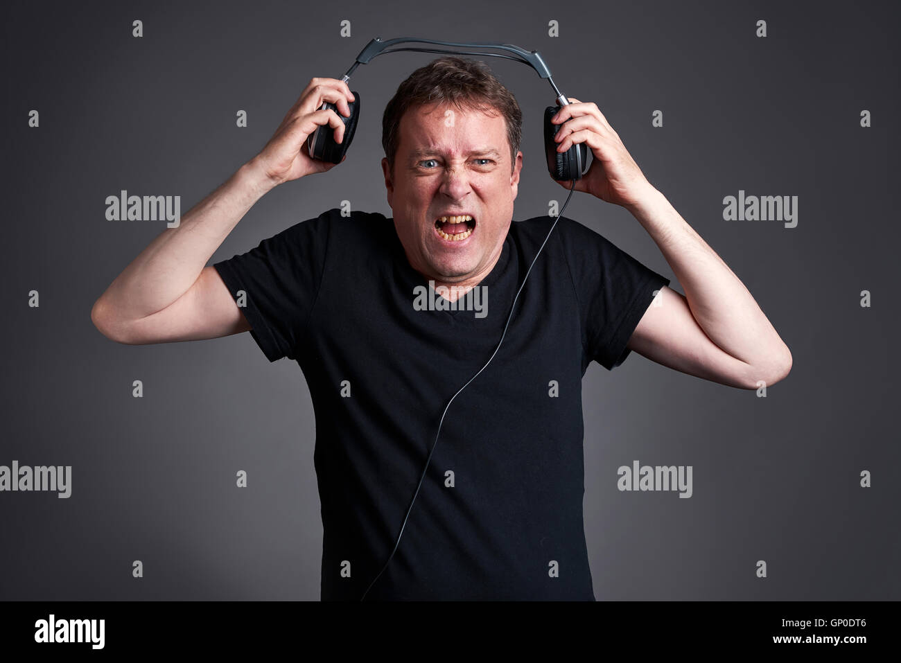 Middle aged man technology frustrated hi-res stock photography and ...