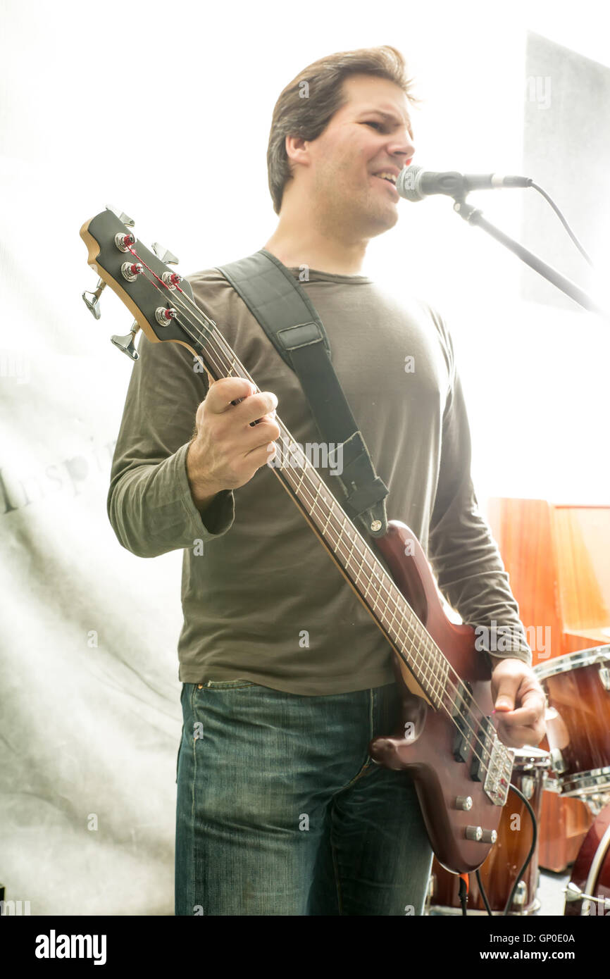 A Rock musician playing bass in the rehearsal Studio Stock Photo - Alamy