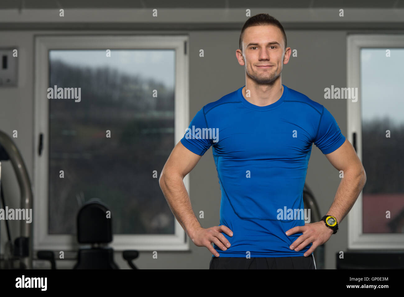 Handsome Personal Trainer Wearing Sportswear In Fitness Center Gym ...