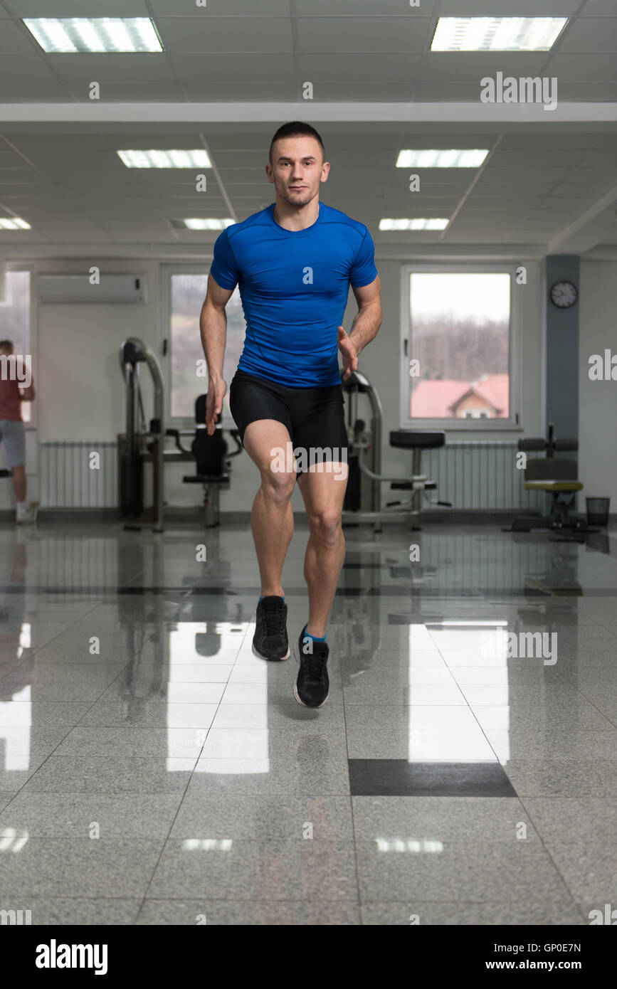 Young Man Doing Functional Workout At The Gym Jumping Around Stock ...