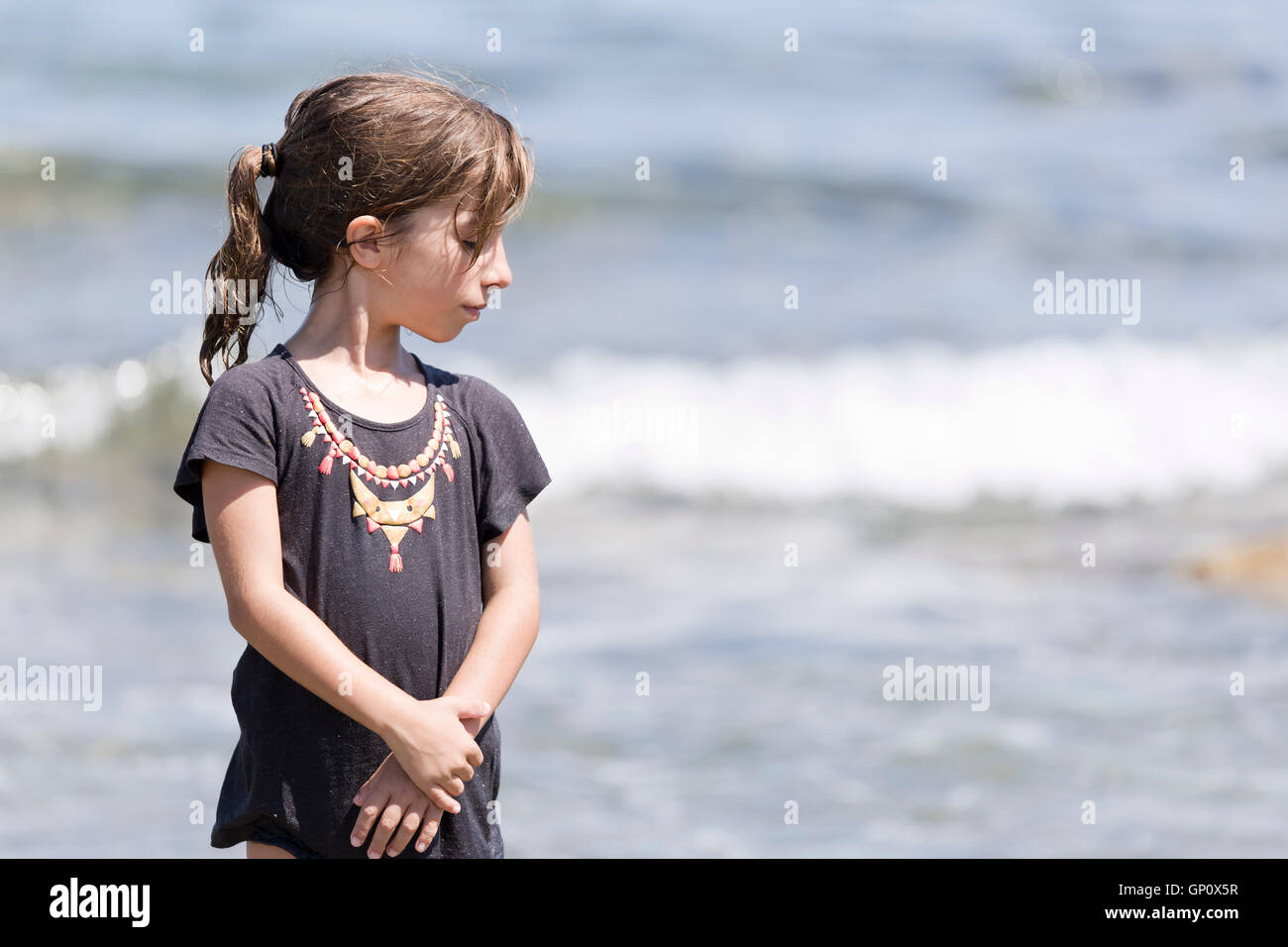 Girl with arms raised and smiling face Stock Photo - Alamy