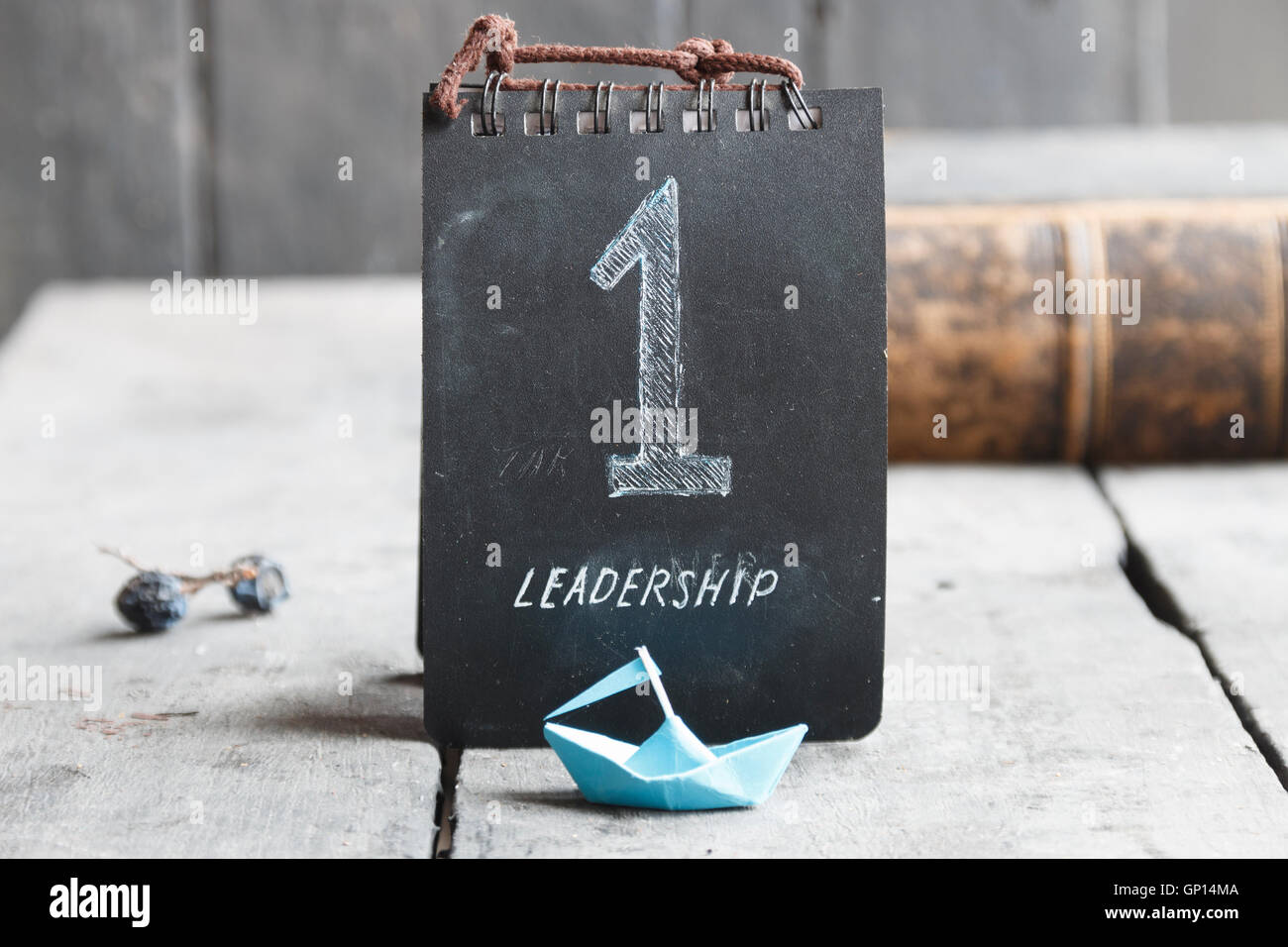 word Leadership, Number One and a paper boat Stock Photo - Alamy