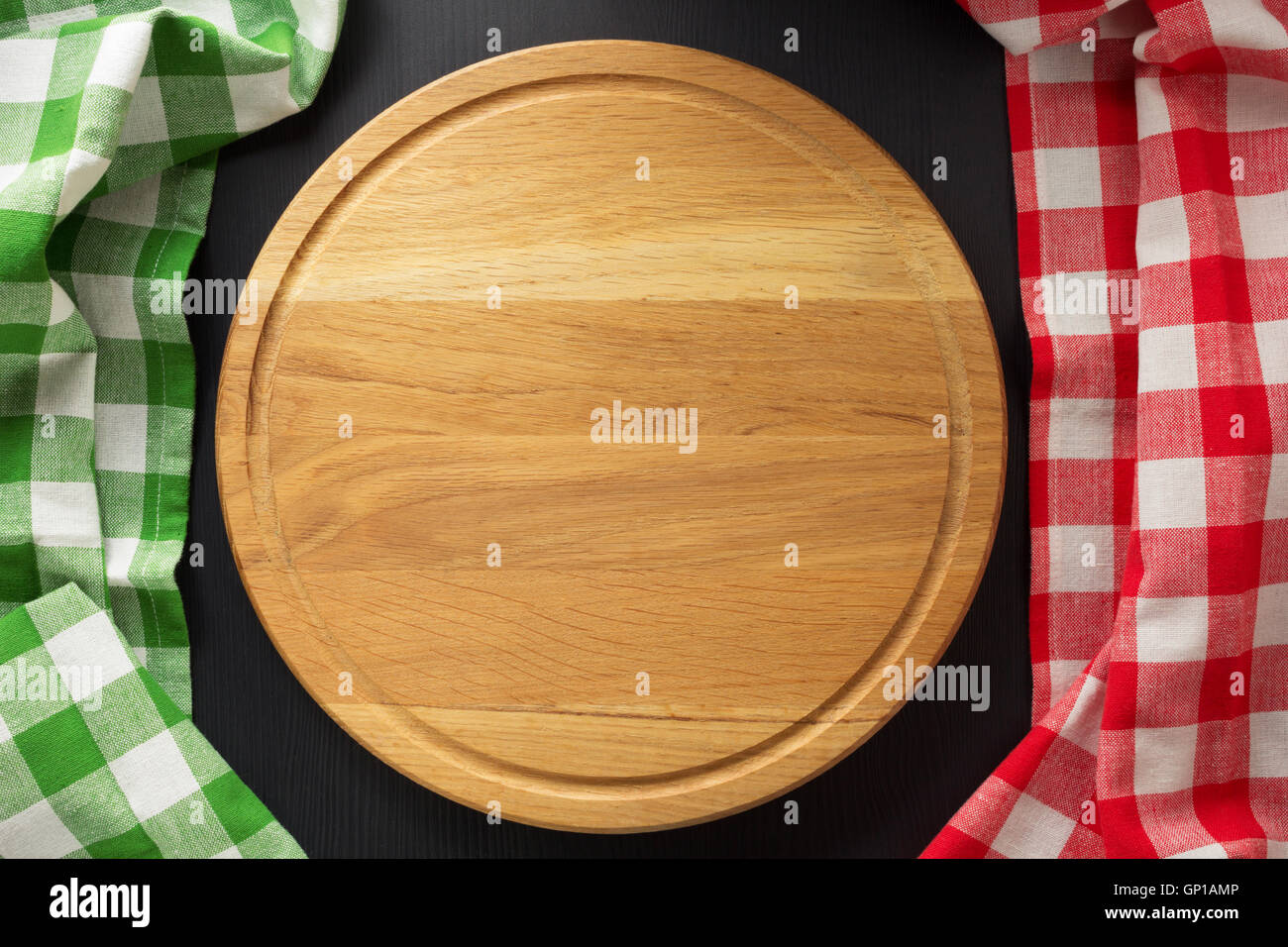 cutting board at wooden table surface Stock Photo - Alamy