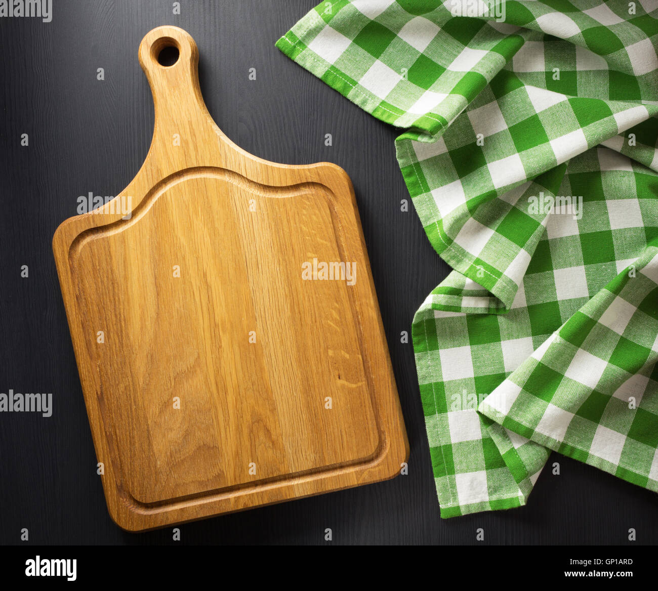 cutting board at wooden table surface Stock Photo - Alamy