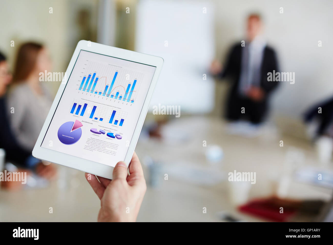 Touchpad with electronic data held by business person Stock Photo - Alamy