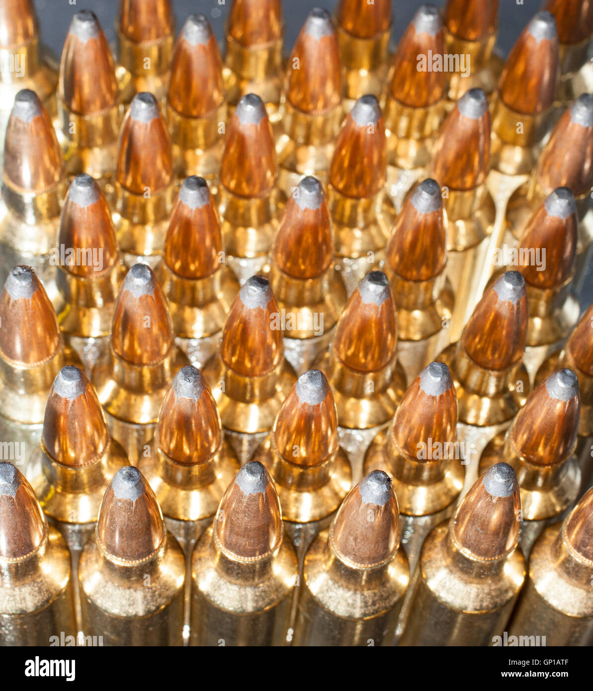 Polished cartridges that are used in a high powered weapon Stock Photo ...