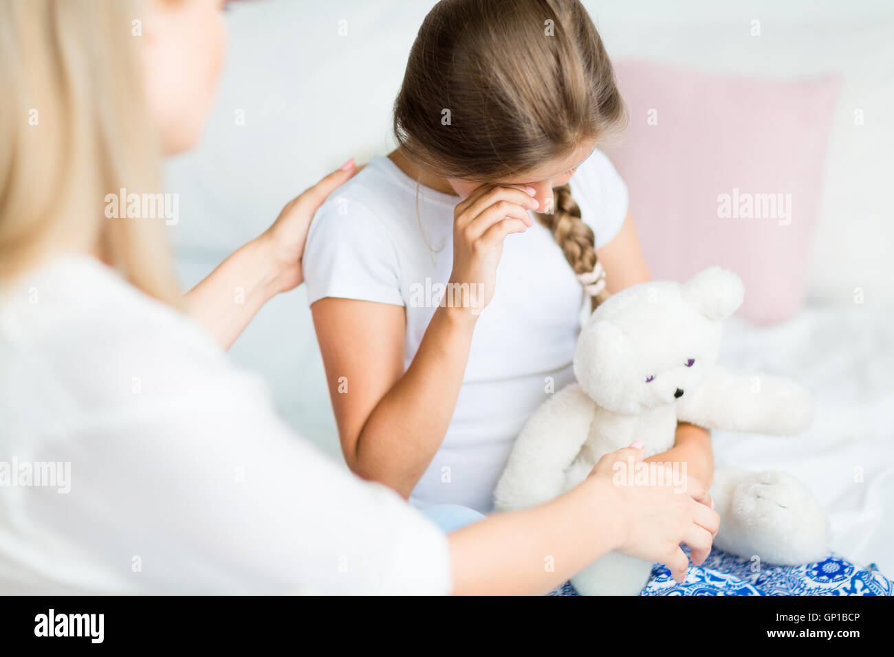 Child wiping tears of mother hi-res stock photography and images - Alamy