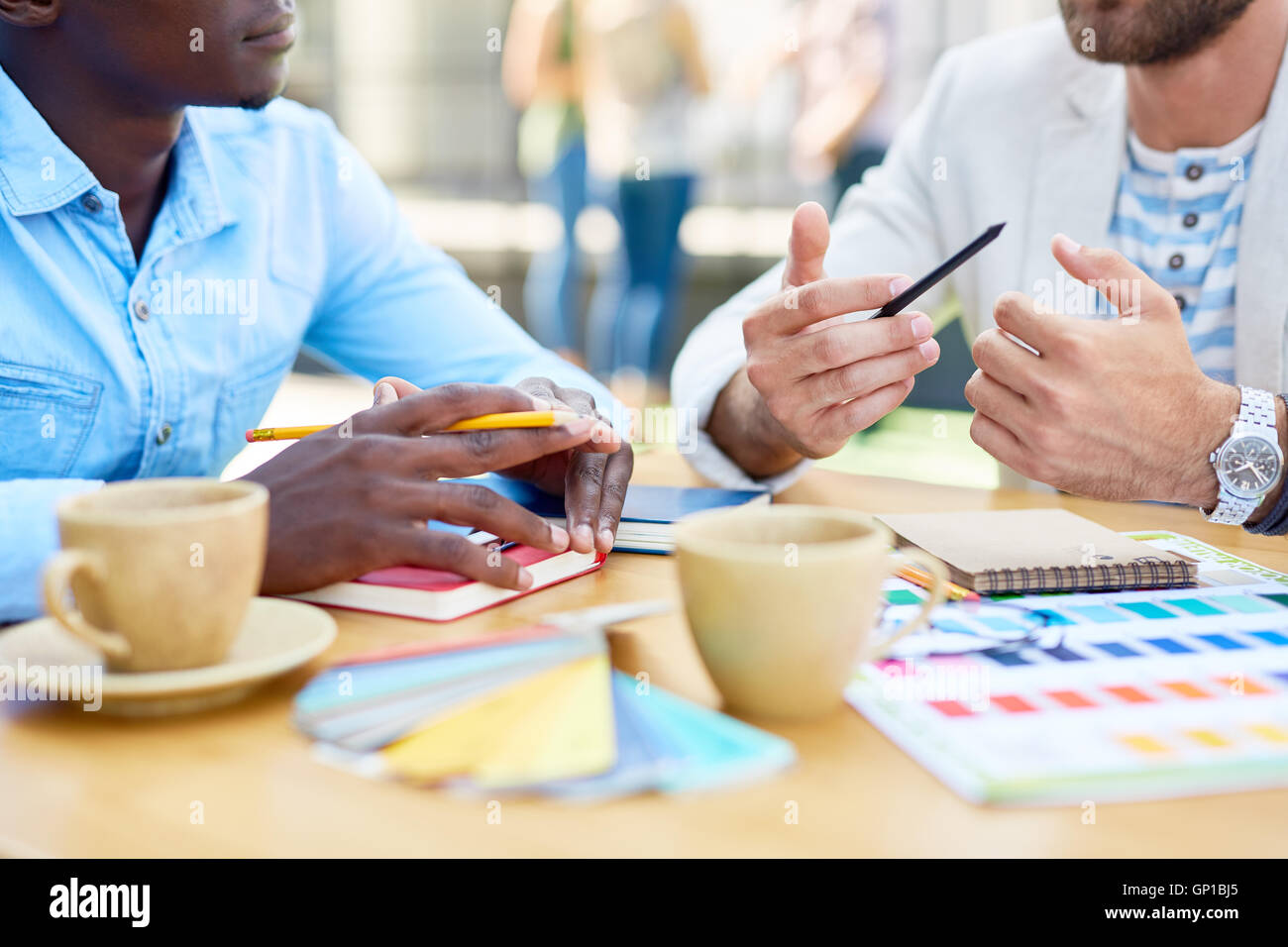 Human hands during business discussion Stock Photo - Alamy