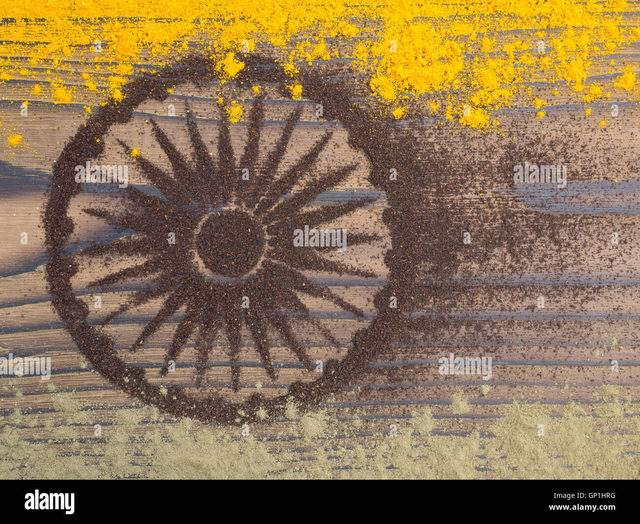 Indian curry and tea powder form India flag on the textured dark wooden ...