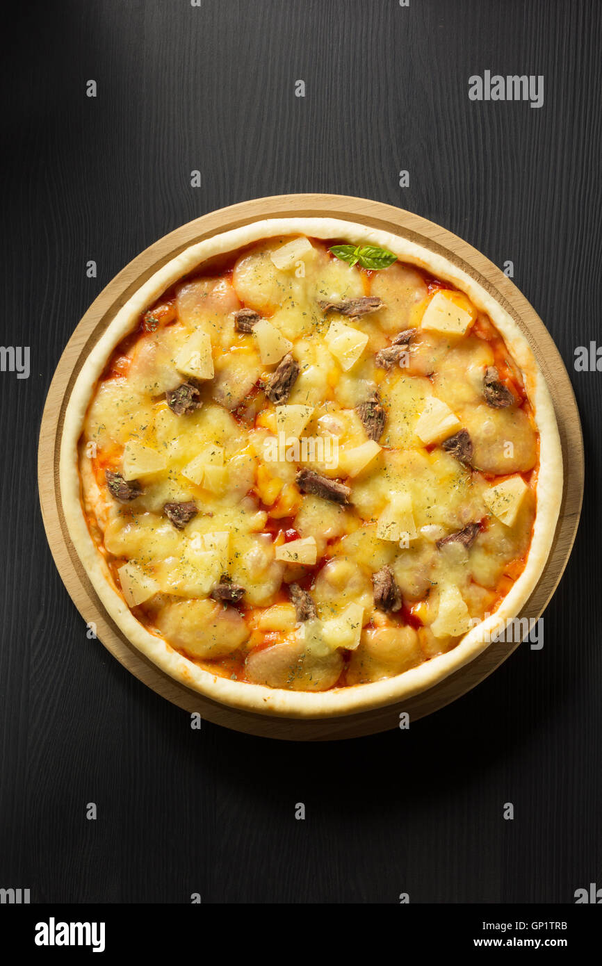 italian pizza at table background Stock Photo - Alamy