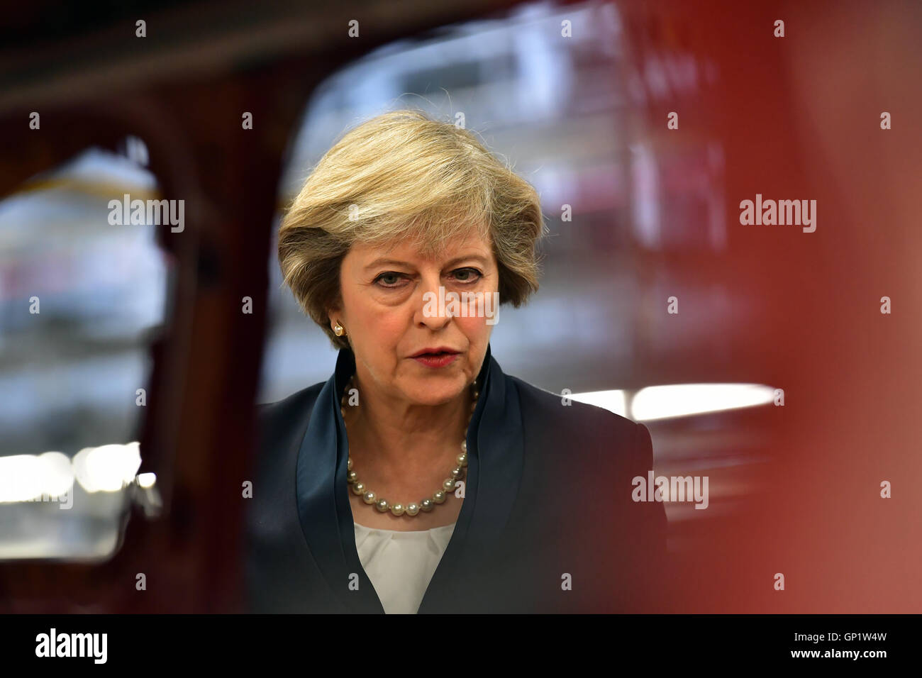 Prime Minister Theresa May views a car on a production line during a ...