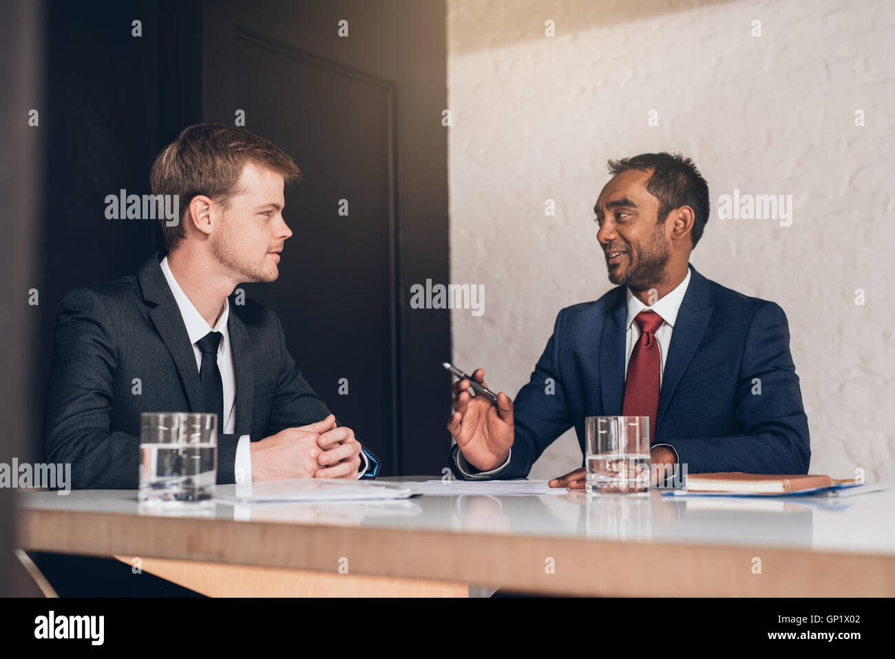 Masters of negotiating at work in the boardroom Stock Photo - Alamy