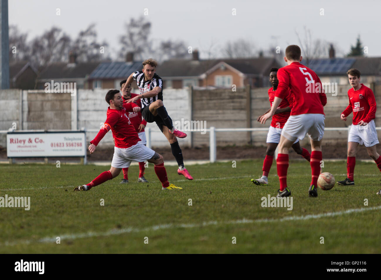 Football player shoots and scores Stock Photo - Alamy