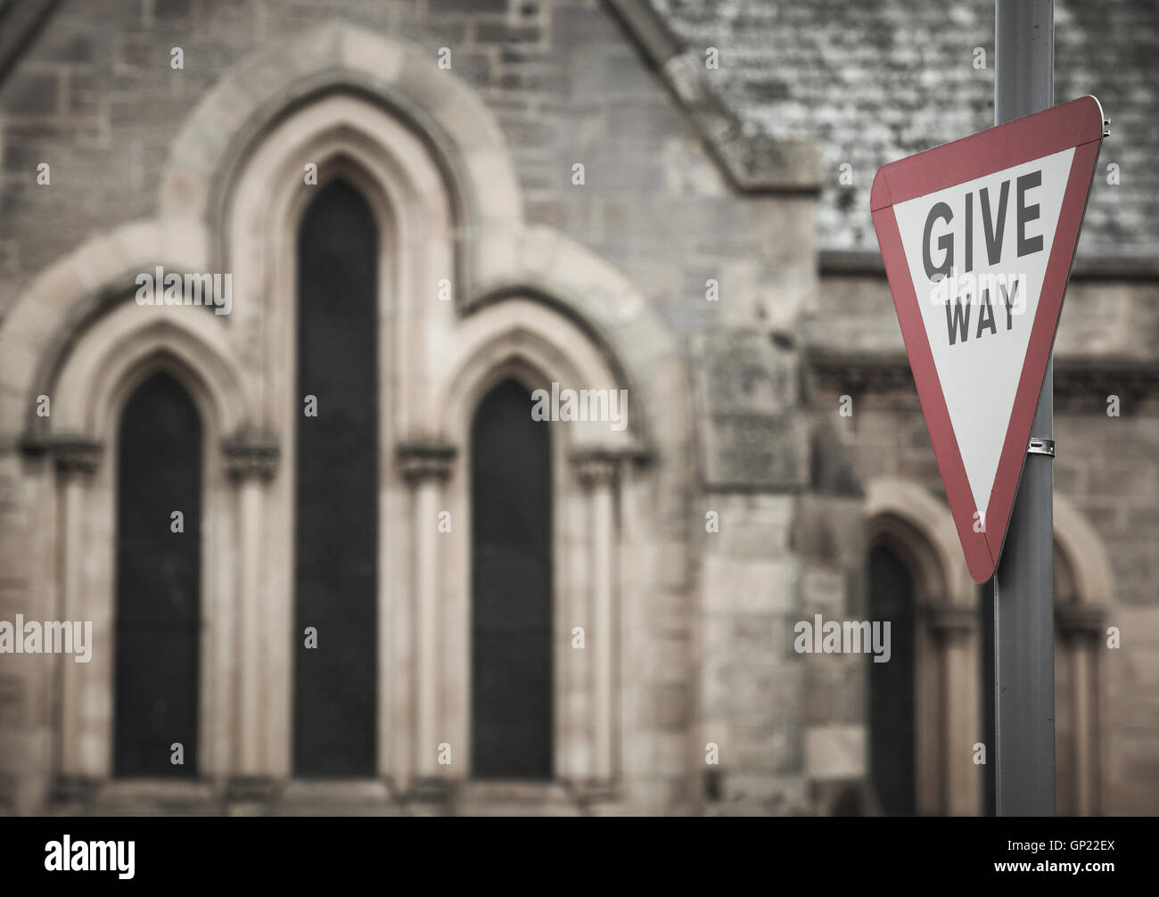 Scottish cathedral detail with traffic signal. Give way Stock Photo - Alamy