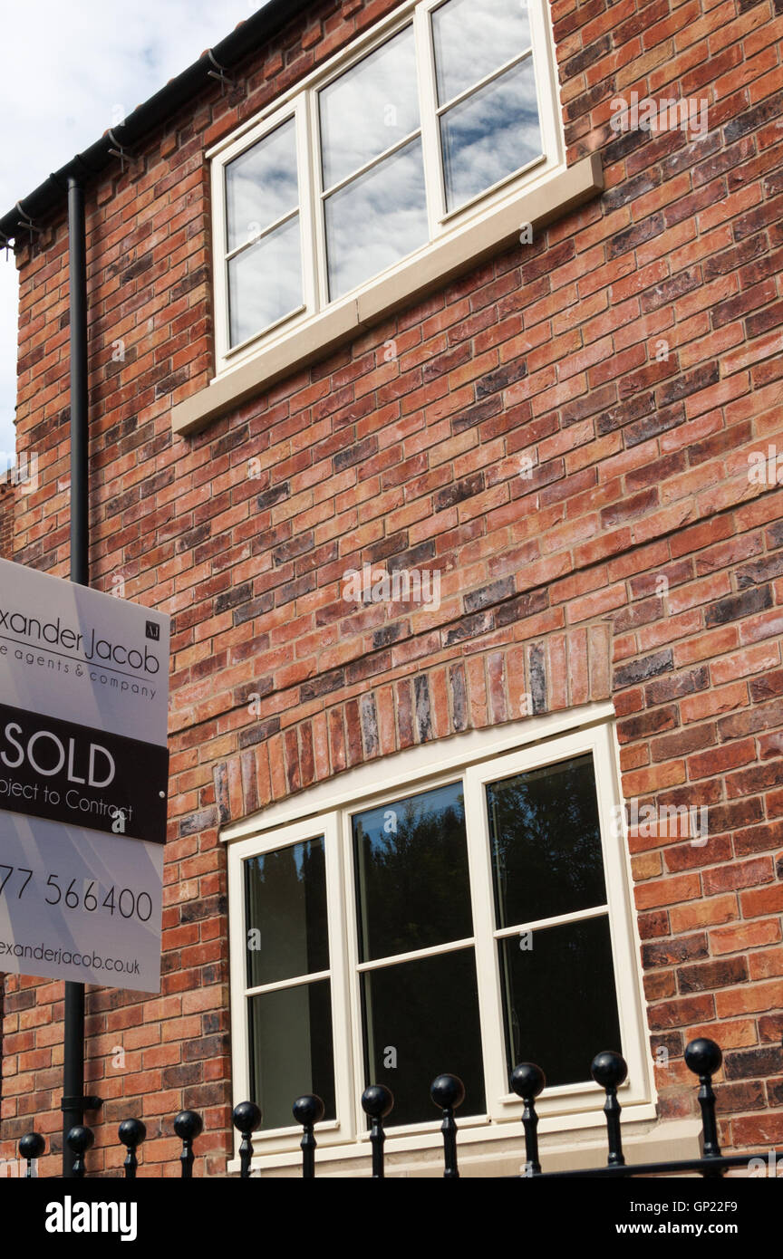 New build house using reclaimed brick House for sale Stock Photo - Alamy