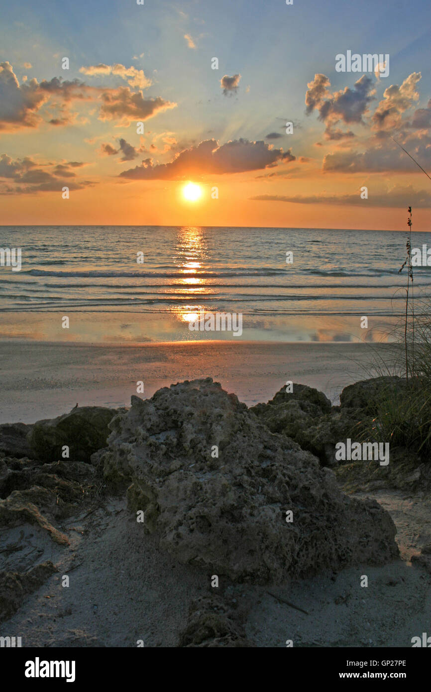 Surf sunset over rocks hi-res stock photography and images - Alamy