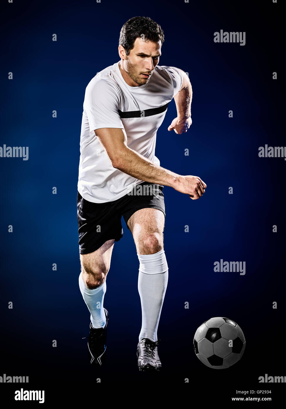 one caucasian soccer player man isolated on black background Stock ...