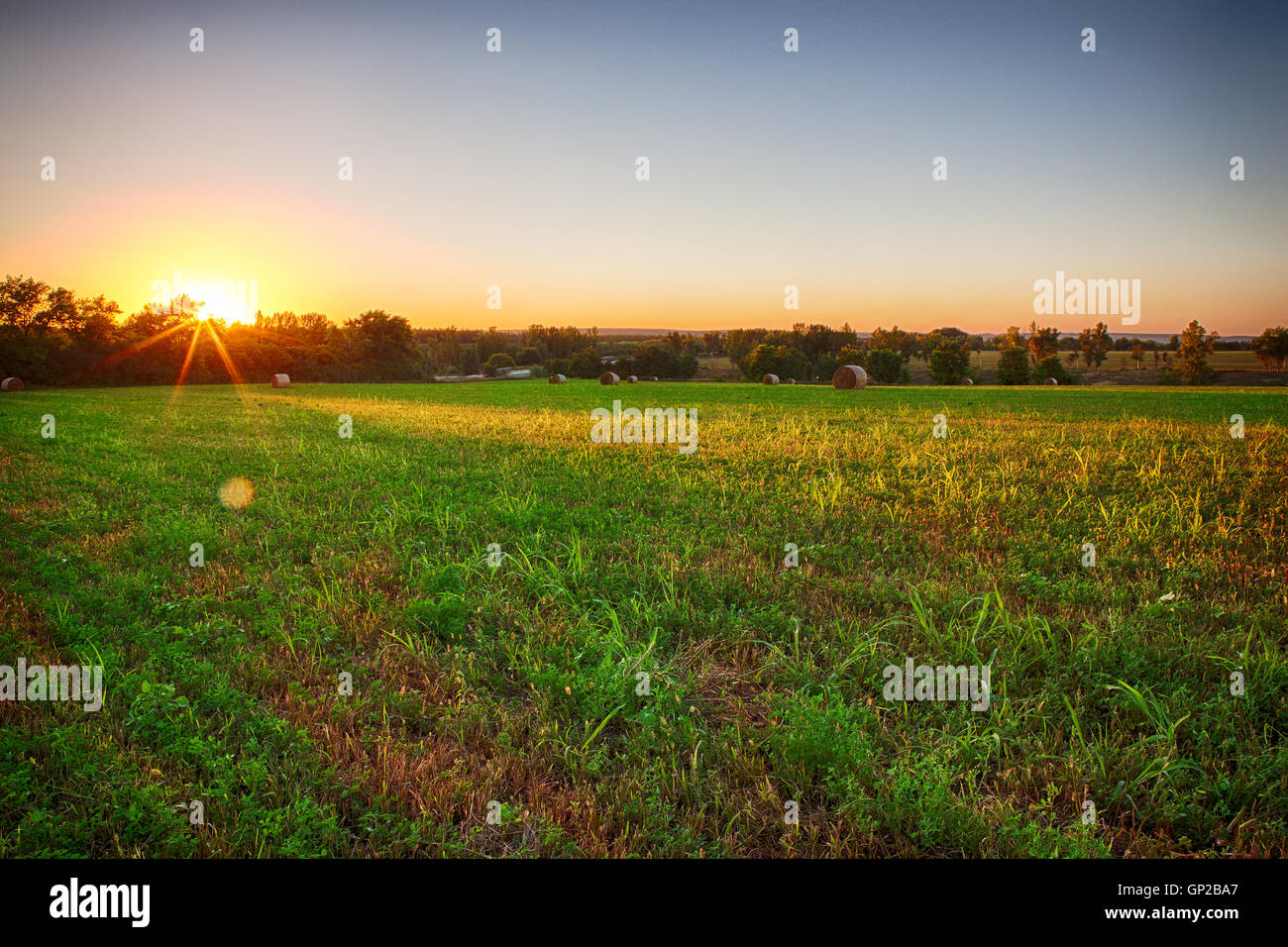 Green Field and Beautiful Sunset Stock Photo - Alamy