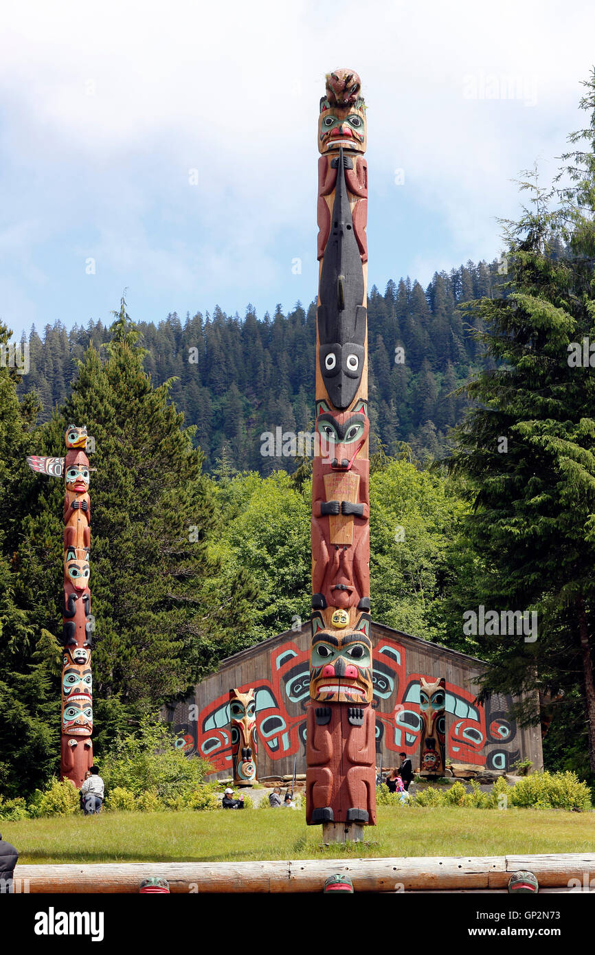 Carved cedar Tlingit totem poles and clan house detail Saxman Totem ...