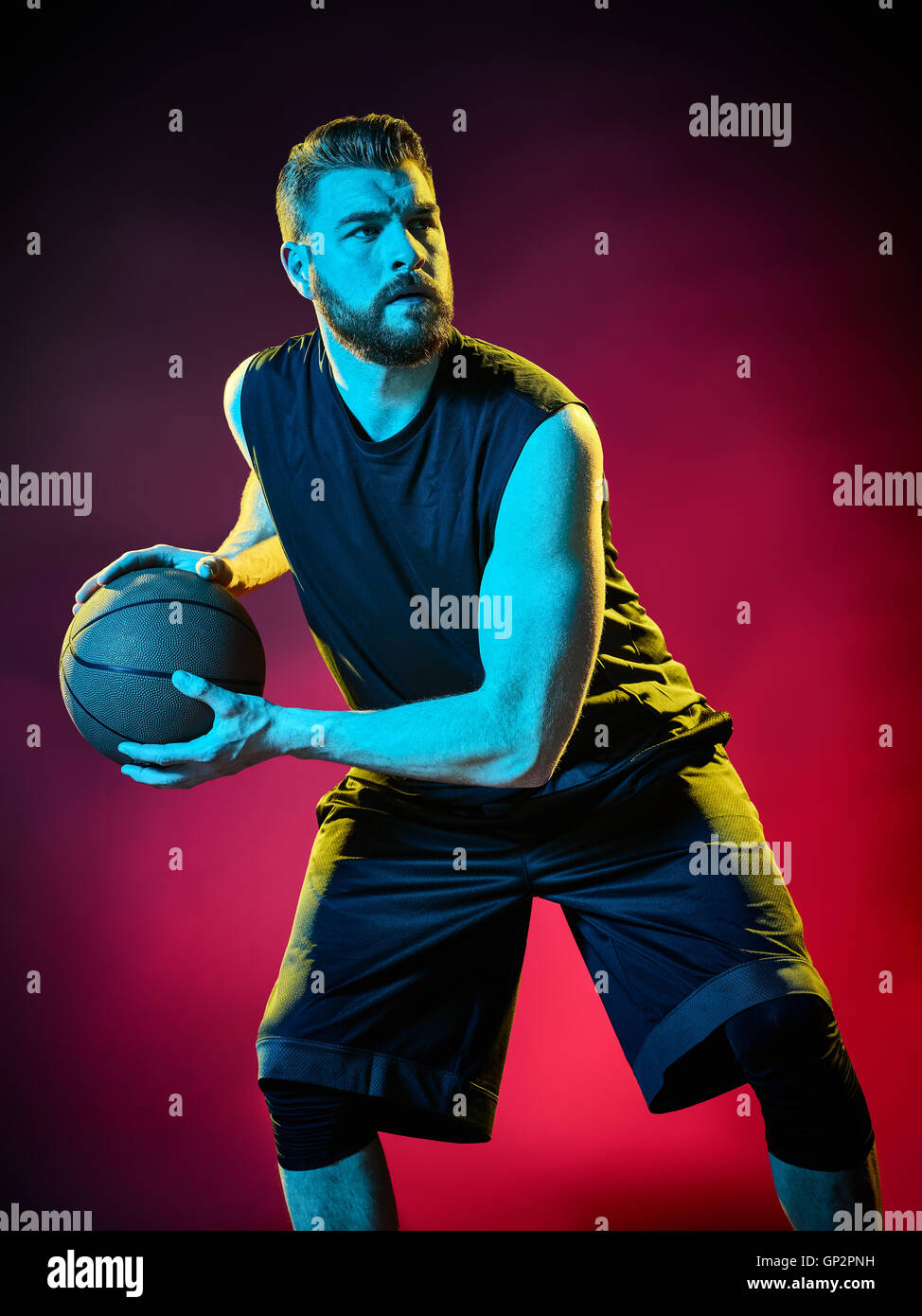 one basketball player man Isolated on black background Stock Photo - Alamy