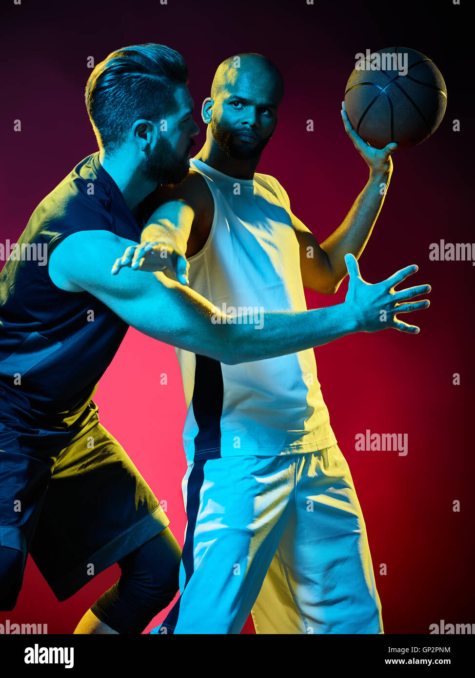 two basketball players men Isolated on black background Stock Photo - Alamy