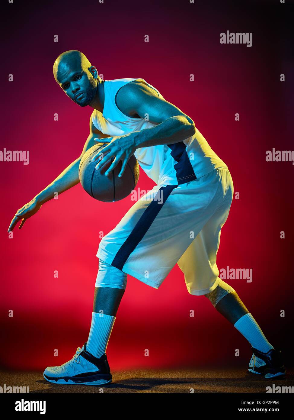 one basketball player man Isolated on black background Stock Photo - Alamy