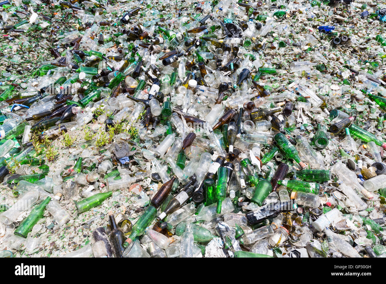 Glass waste for recycling in a recycling facility. Different glass ...