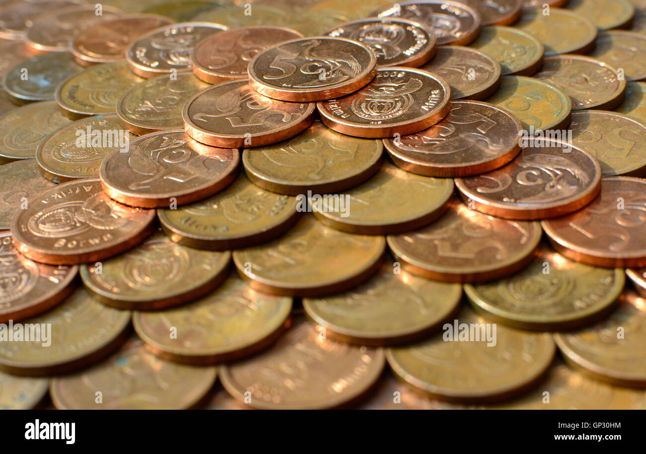 Pyramid of coins also forming a cross. Pyramid scheme Stock Photo - Alamy