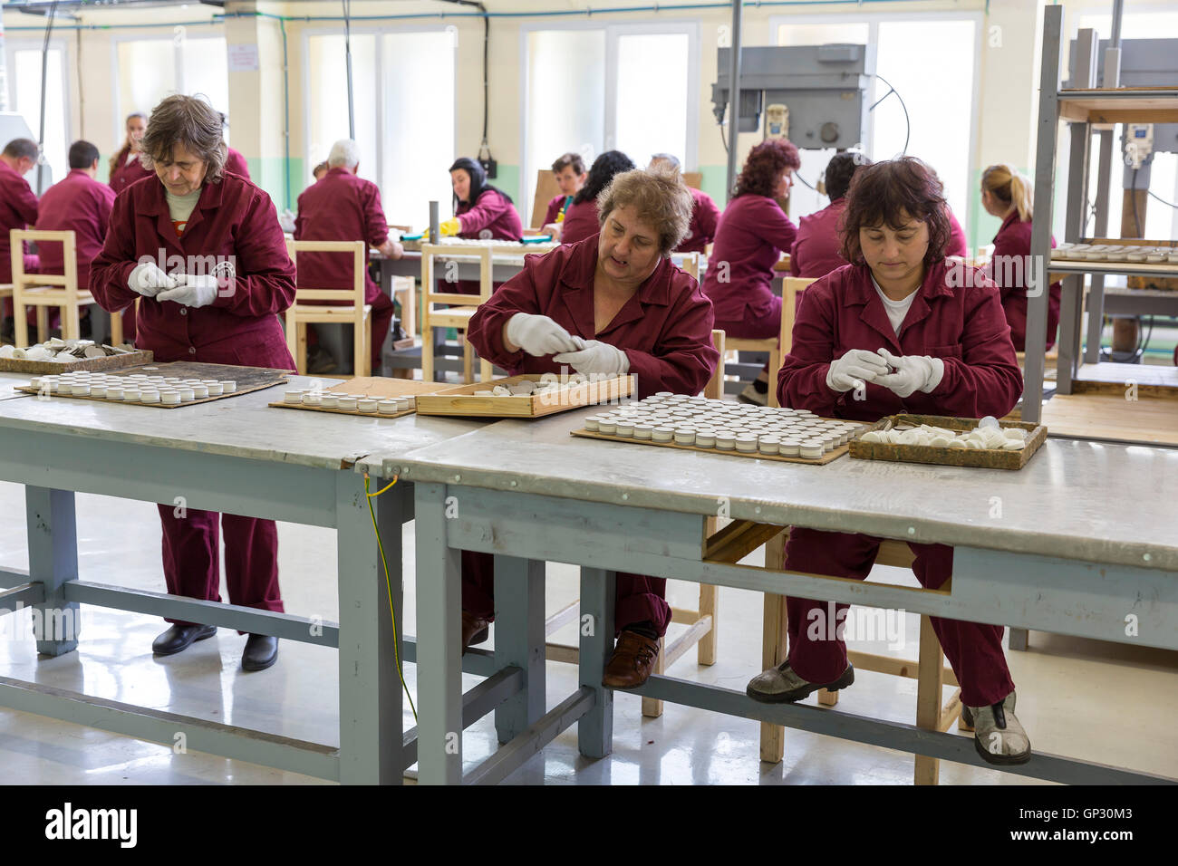 Sopot, Bulgaria - May 17, 2016: Arsenal women workers are producing ...