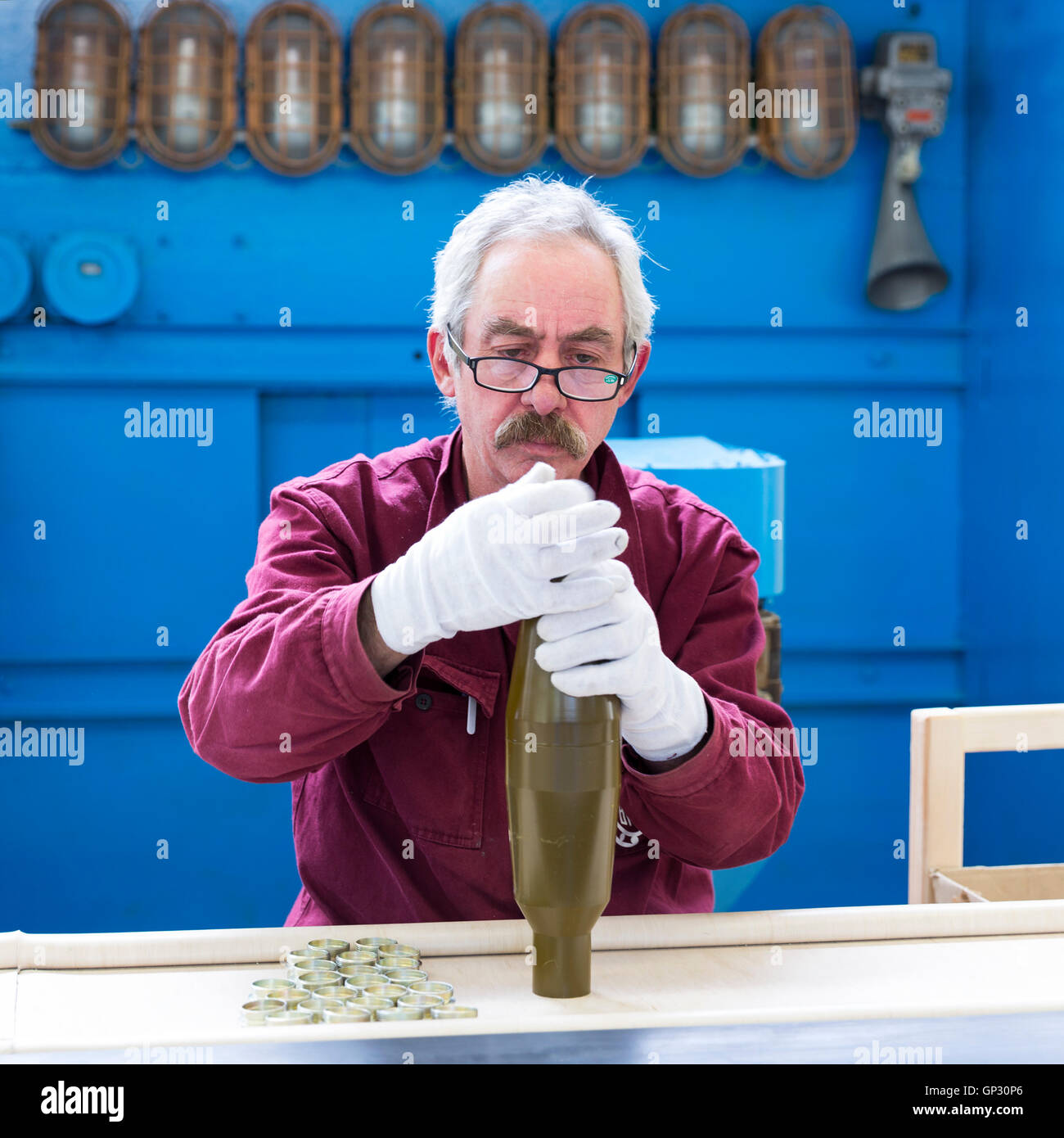 Sopot, Bulgaria - May 17, 2016: Arsenal worker is producing warheads in ...