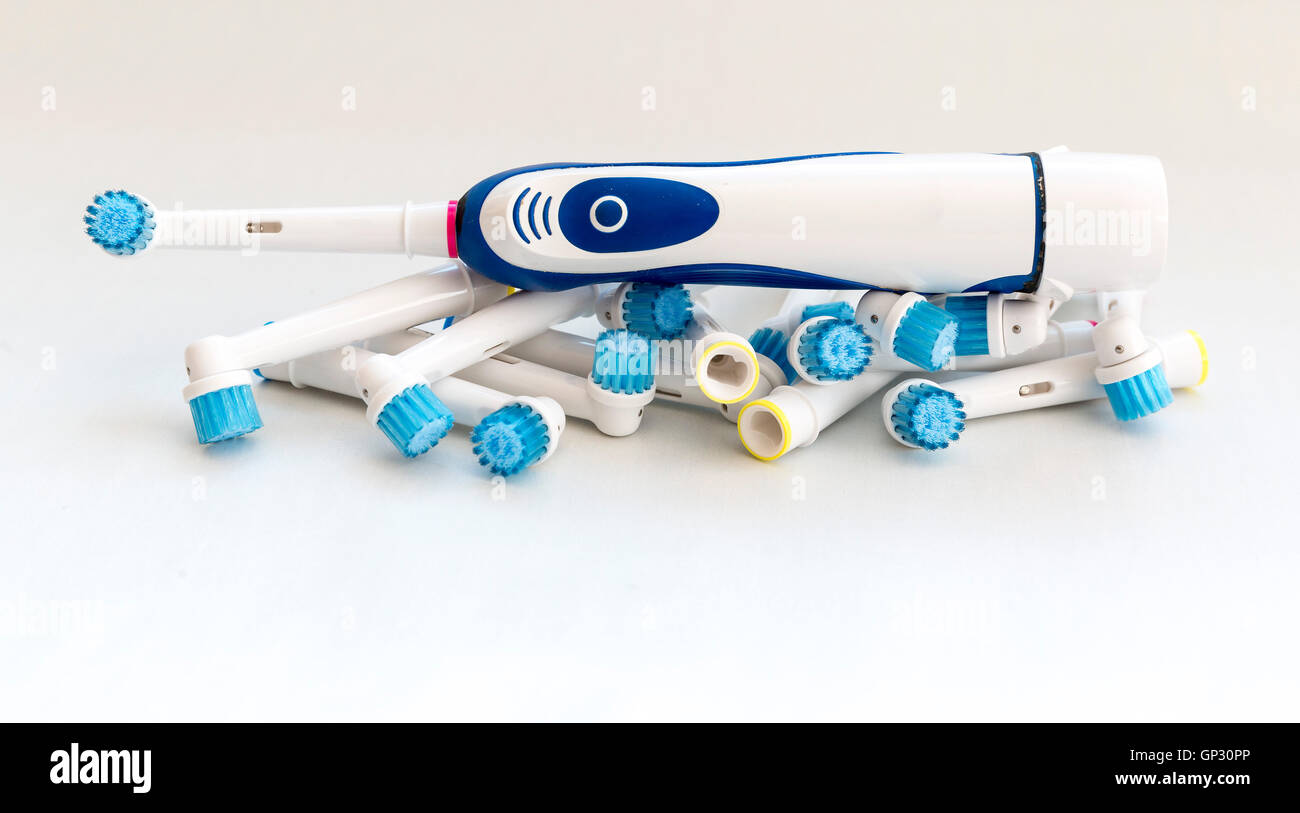 Electronic toothbrush with toothbrush heads isolated on a white ...