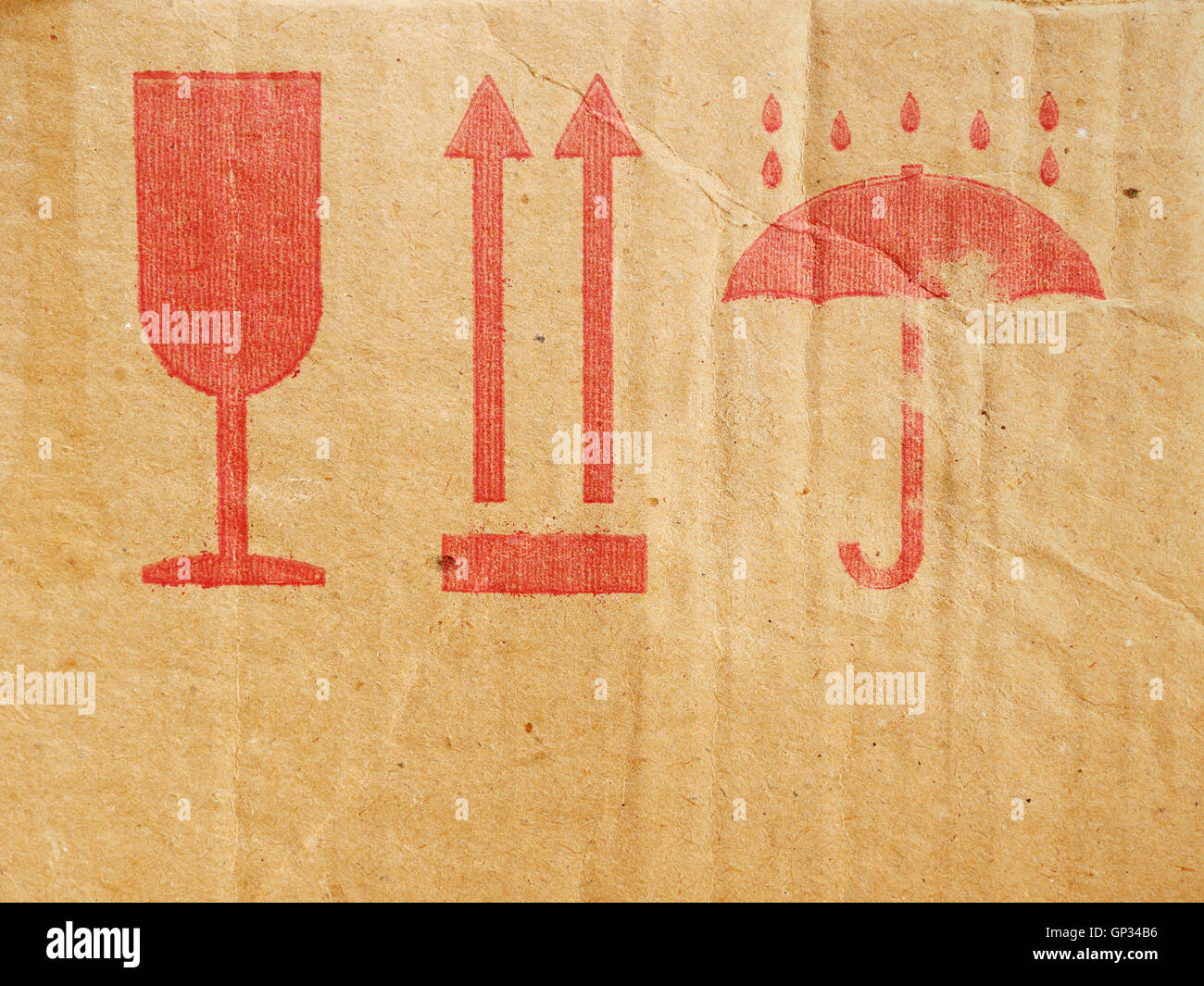Packing symbols on cardboard box Stock Photo - Alamy