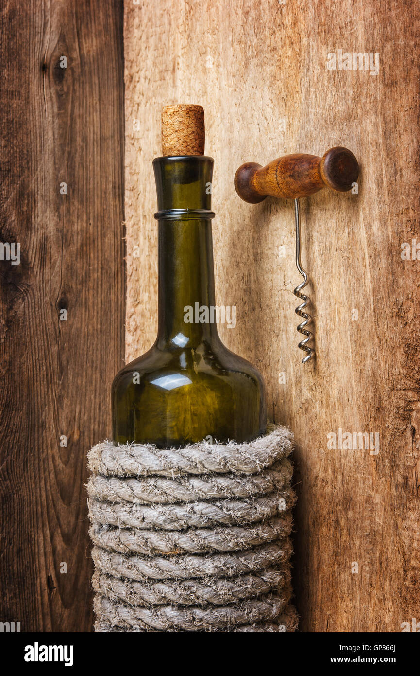 bottle of wine wrapped with rope Stock Photo - Alamy