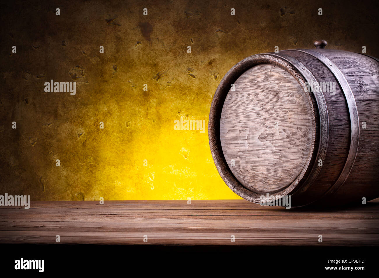 Wooden round barrel on yellow gradient background Stock Photo - Alamy