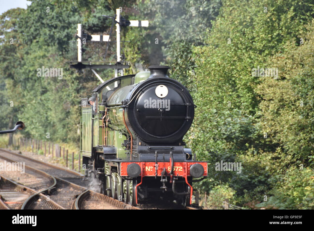 Steam locomotive B12 approaches Holt station to pick its carriages ...