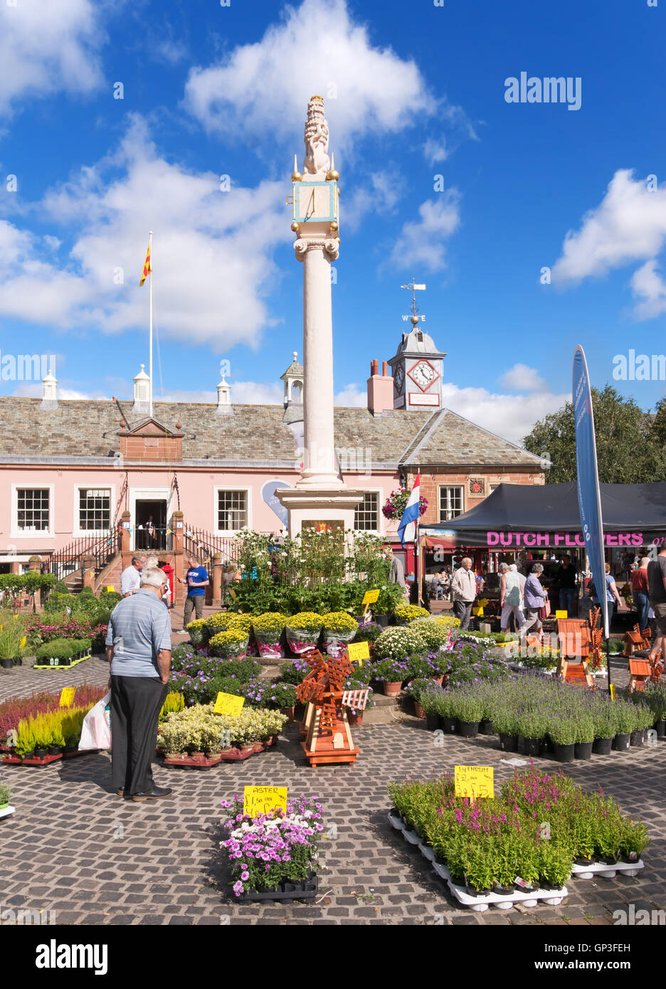 People visiting Carlisle 17th century market cross and square, Cumbria ...
