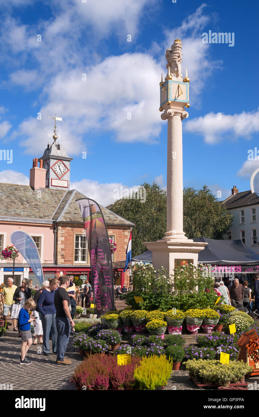 People visiting Carlisle 17th century market cross and square, Cumbria ...