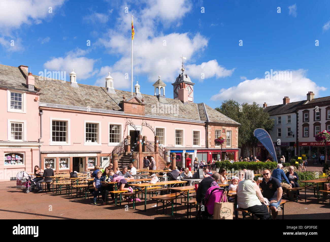 People sitting outside in Carlisle market square, Cumbria, England, UK ...