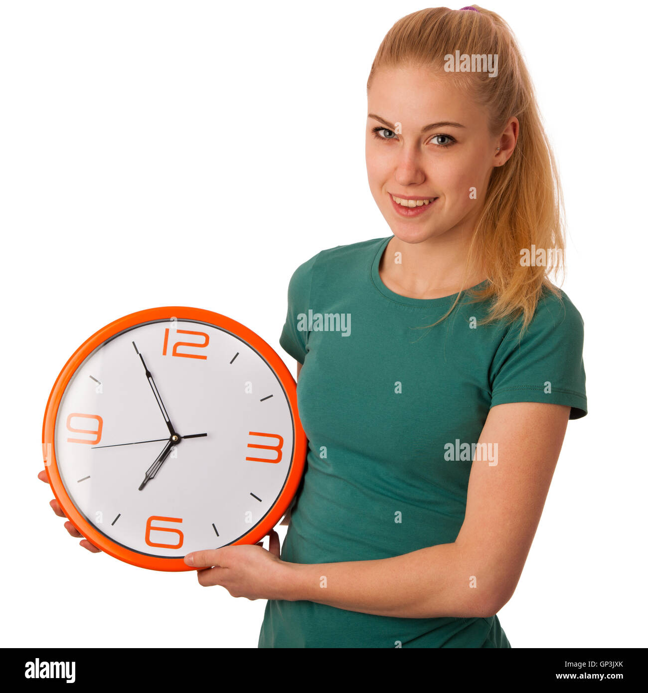 Blonde woman holding big clock in hand with fresh morning smile ...