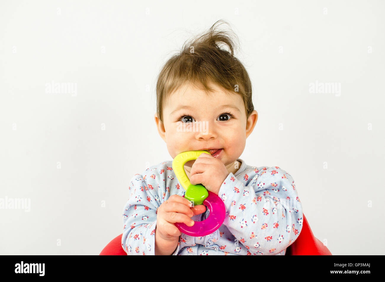 adorable baby girl teething and chewing teethers Stock Photo - Alamy