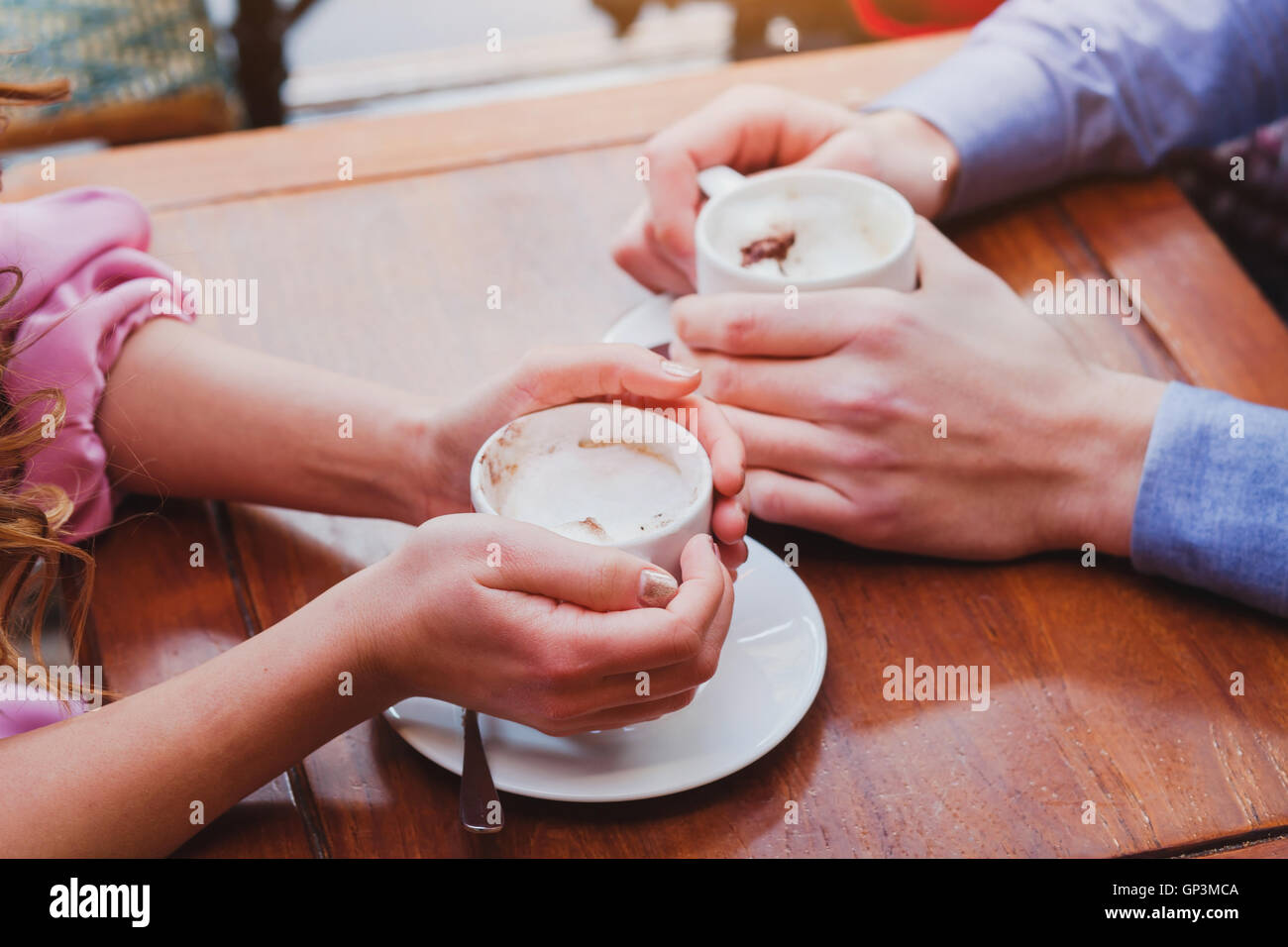 people drinking coffee in cafe, closeup of couple hands with cups Stock ...