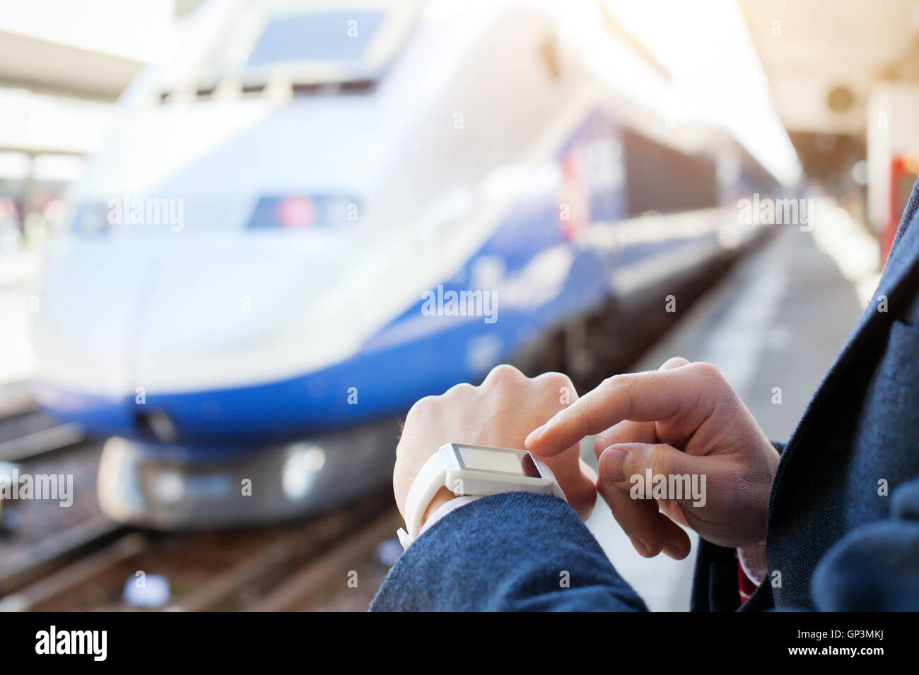 passenger using smart watch at train station Stock Photo - Alamy