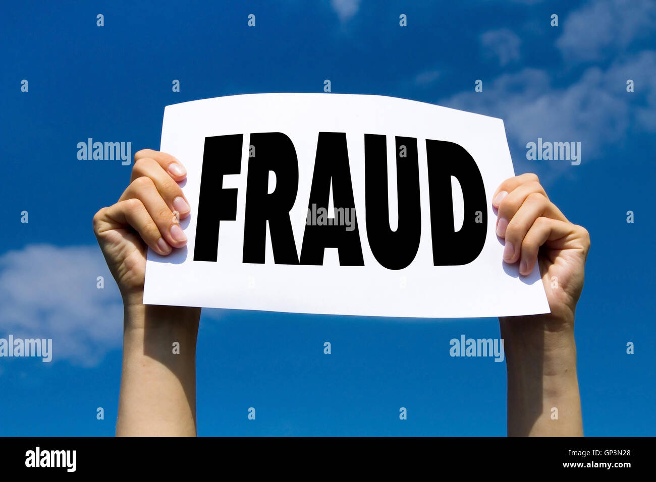 fraud sign, concept, hands holding paper sign Stock Photo - Alamy