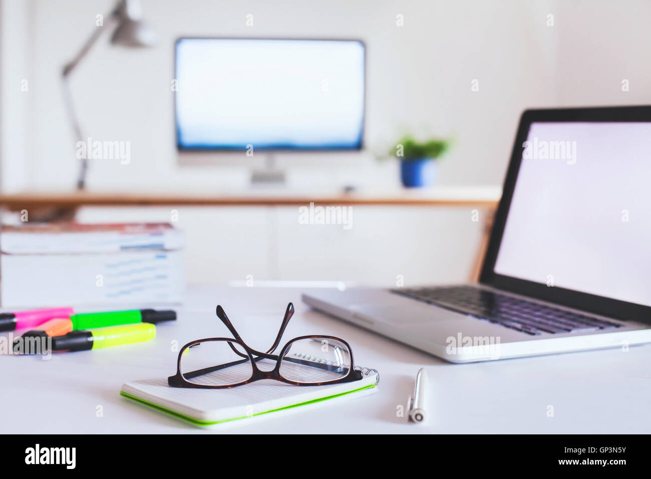 office interior background, glasses on the table, workplace with ...