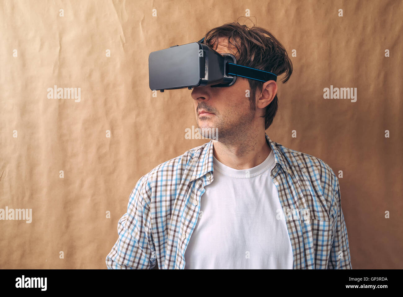 Man with VR goggles exploring virtual reality content and enjoying in ...