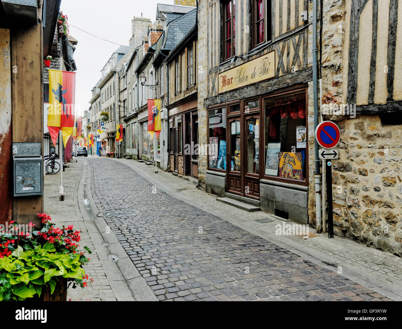 Cobbled street in the centre of the pretty medieval town of Domfront in ...