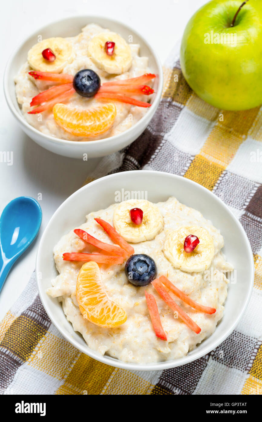School kid breakfast. Oatmeal porridge with animal face, food for kids ...