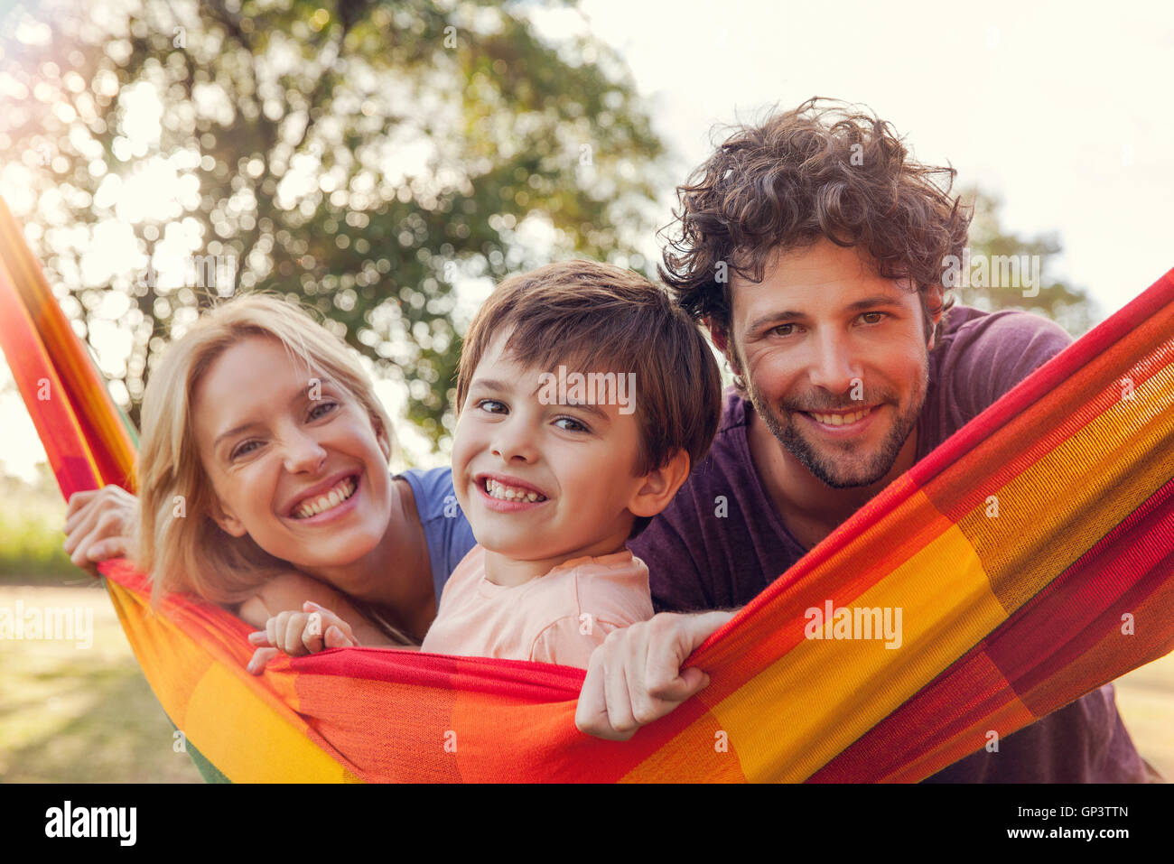 Family relaxing together outdoors, portrait Stock Photo - Alamy