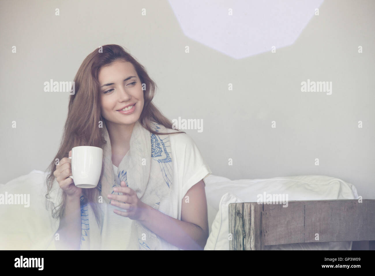 Woman enjoying solitude with cup of tea Stock Photo - Alamy